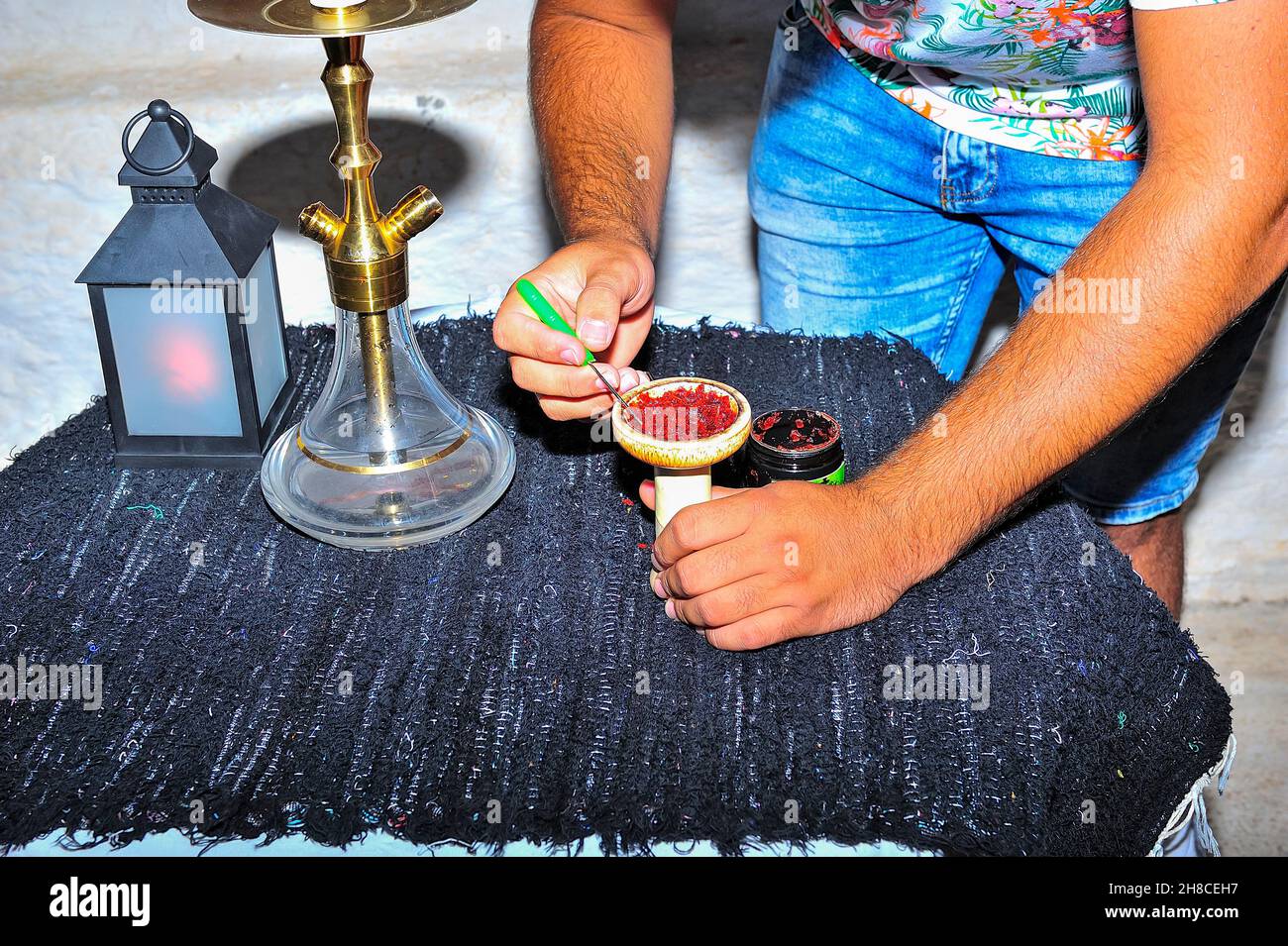 Preparation of a hookah on the terrace of a Pub Stock Photo - Alamy