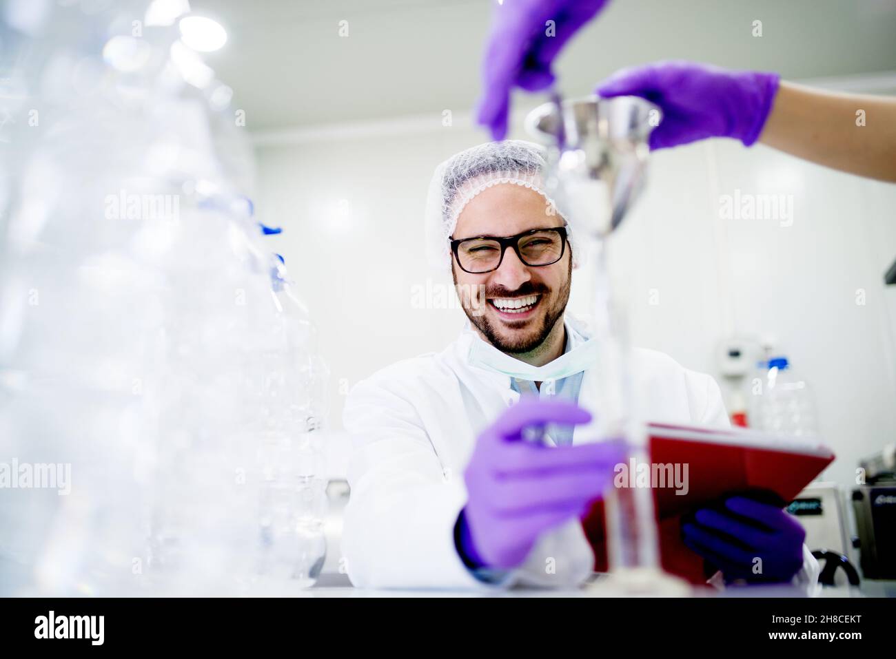 Lab technicians doing chemical analysis. Testing chemical composition ...