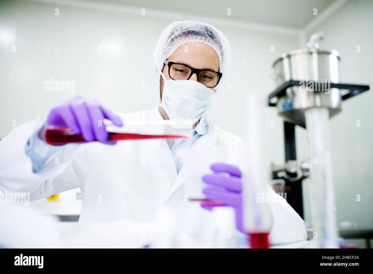 Glass laboratory chemical test tubes with red liquid Stock Photo - Alamy