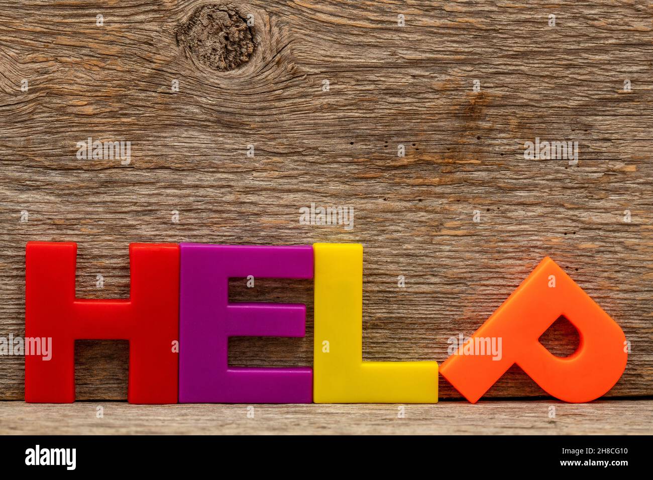 Word HELP made of color plastic letters. Help or assistance concept ...