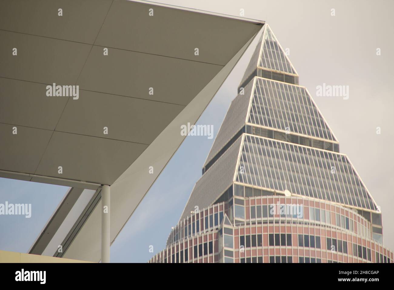 Low angle of a modern skyscraper building landscape, pyramid design in ...