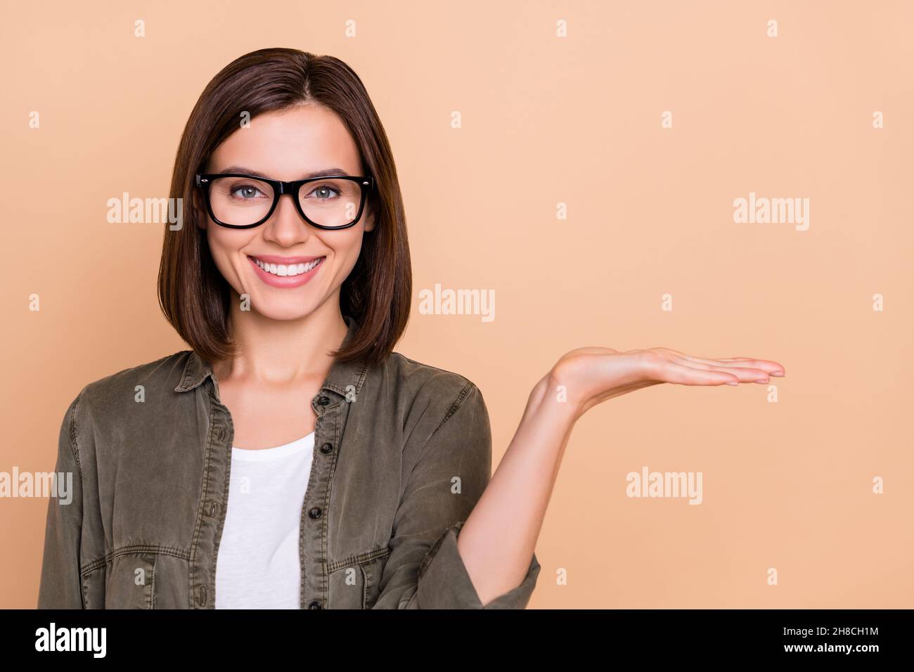 Photo of positive lady palm presenting empty space solution option wear ...