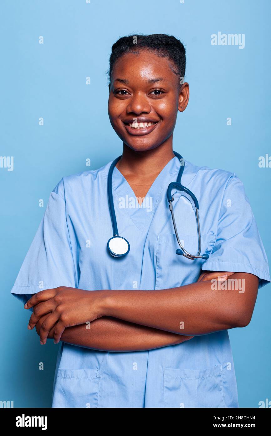 Portrait of african american therapist assistant smiling at camera ...