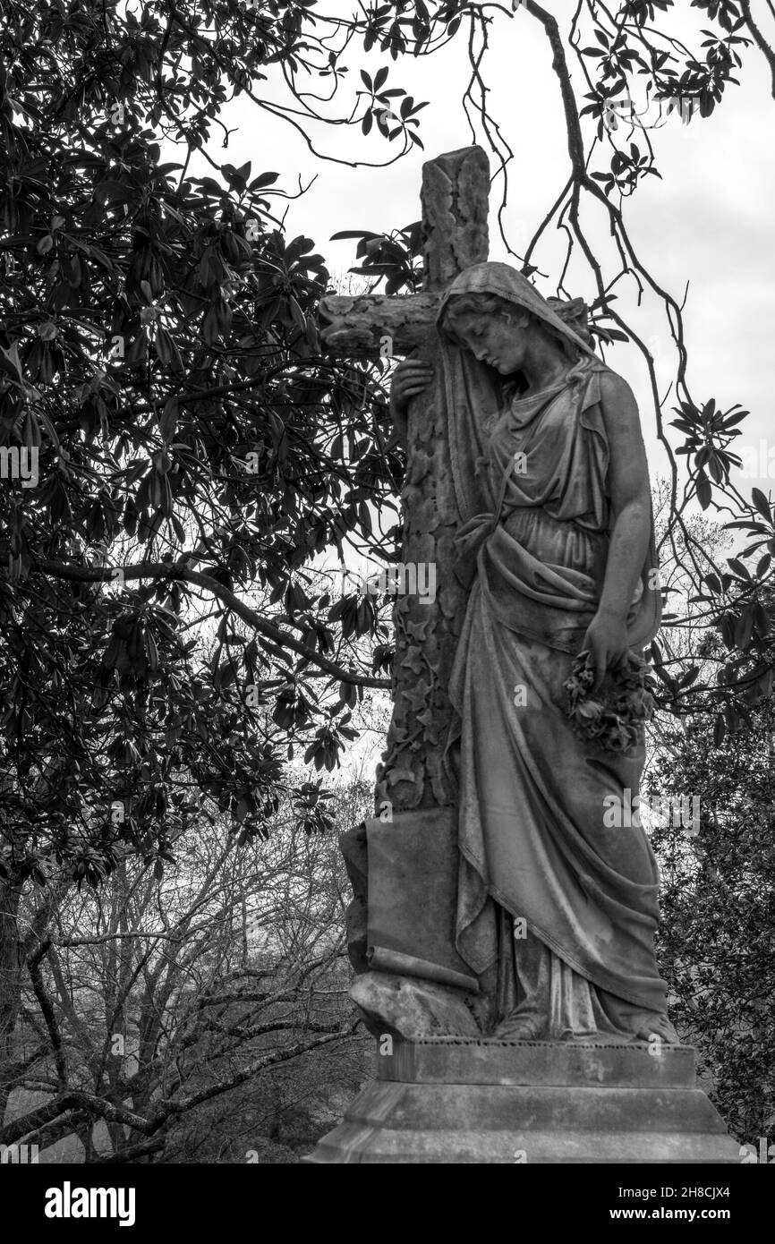 Vertical grayscale shot of a gravestone in Myrtle Hill Cemetery, Rome ...