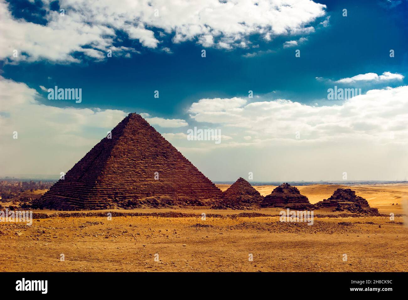 Scenic shot of the Pyramids of Giza in Egypt under the cloudy sky ...