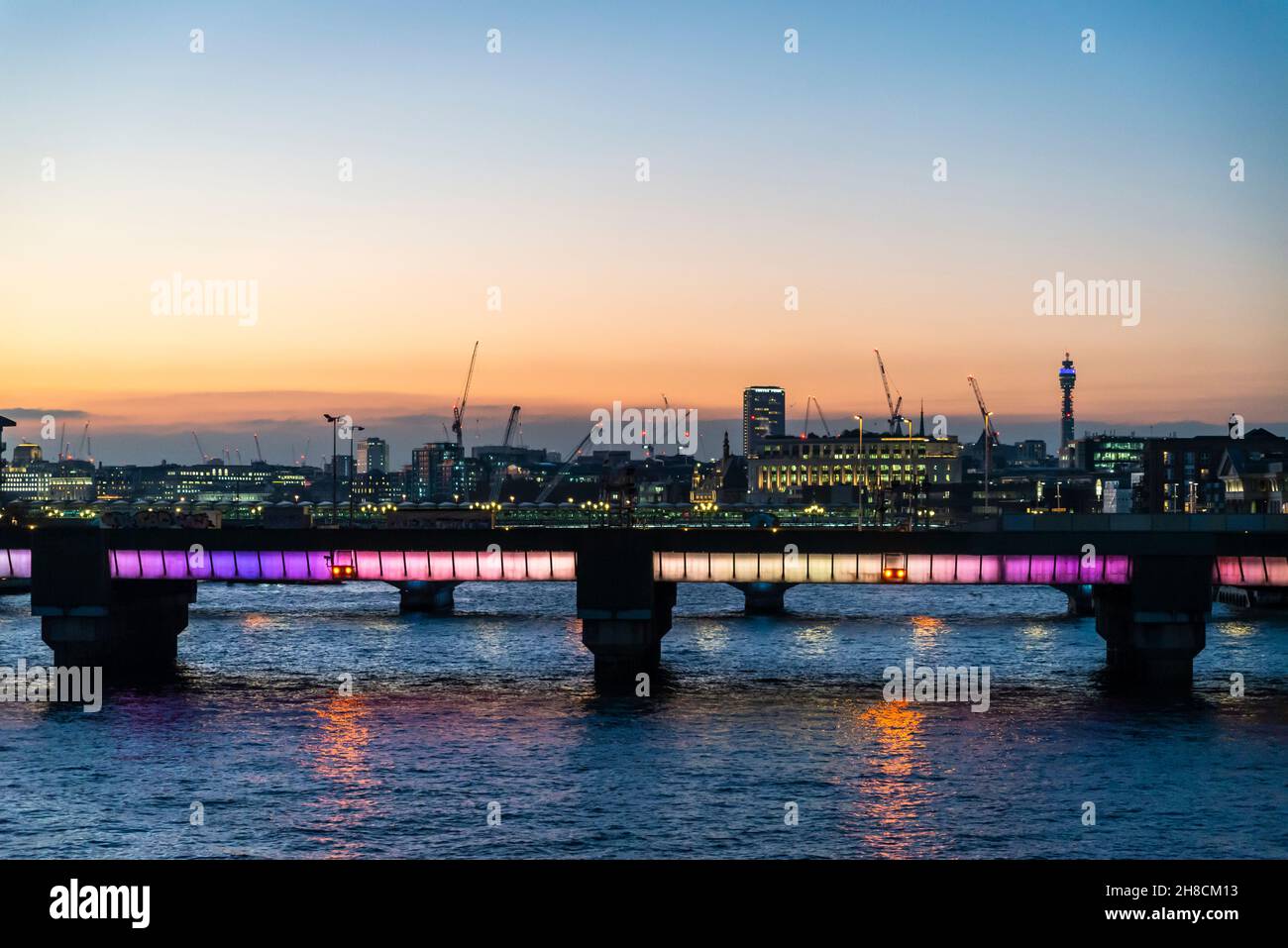 Cannon Street railway bridge illuminated at night, London, England, UK ...
