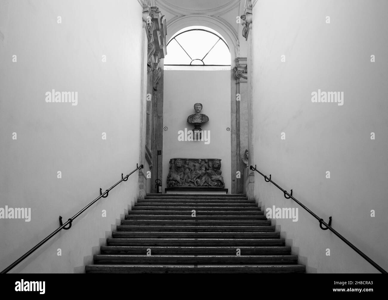 Black and white photo of corridor with steps inside historical building ...