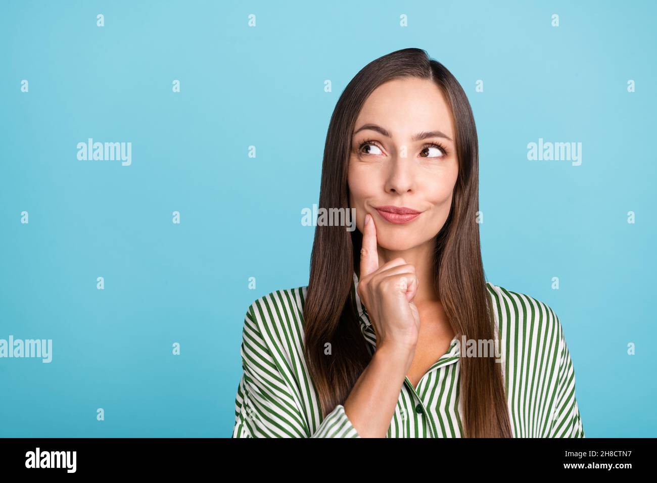 Photo of young lovely woman curious look empty space clever plan ...