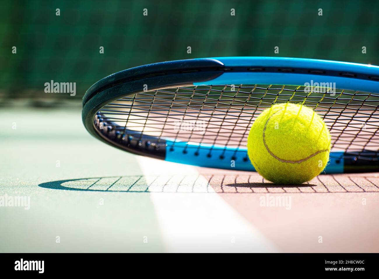 Tennis racket and balls lying on court hi-res stock photography and ...