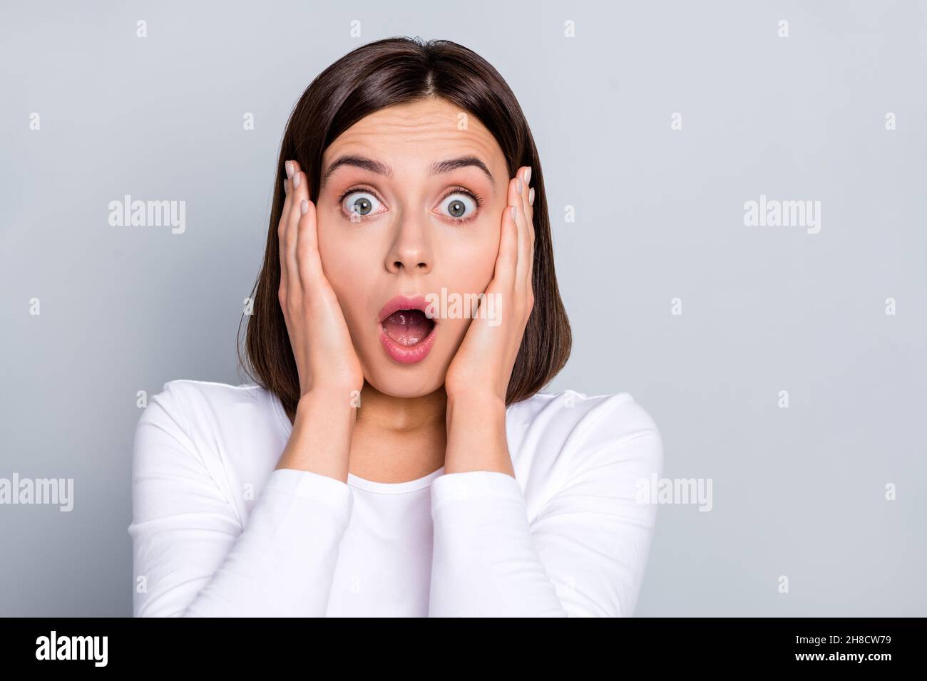 Photo of scared bob hairdo millennial lady arms face wear white shirt ...