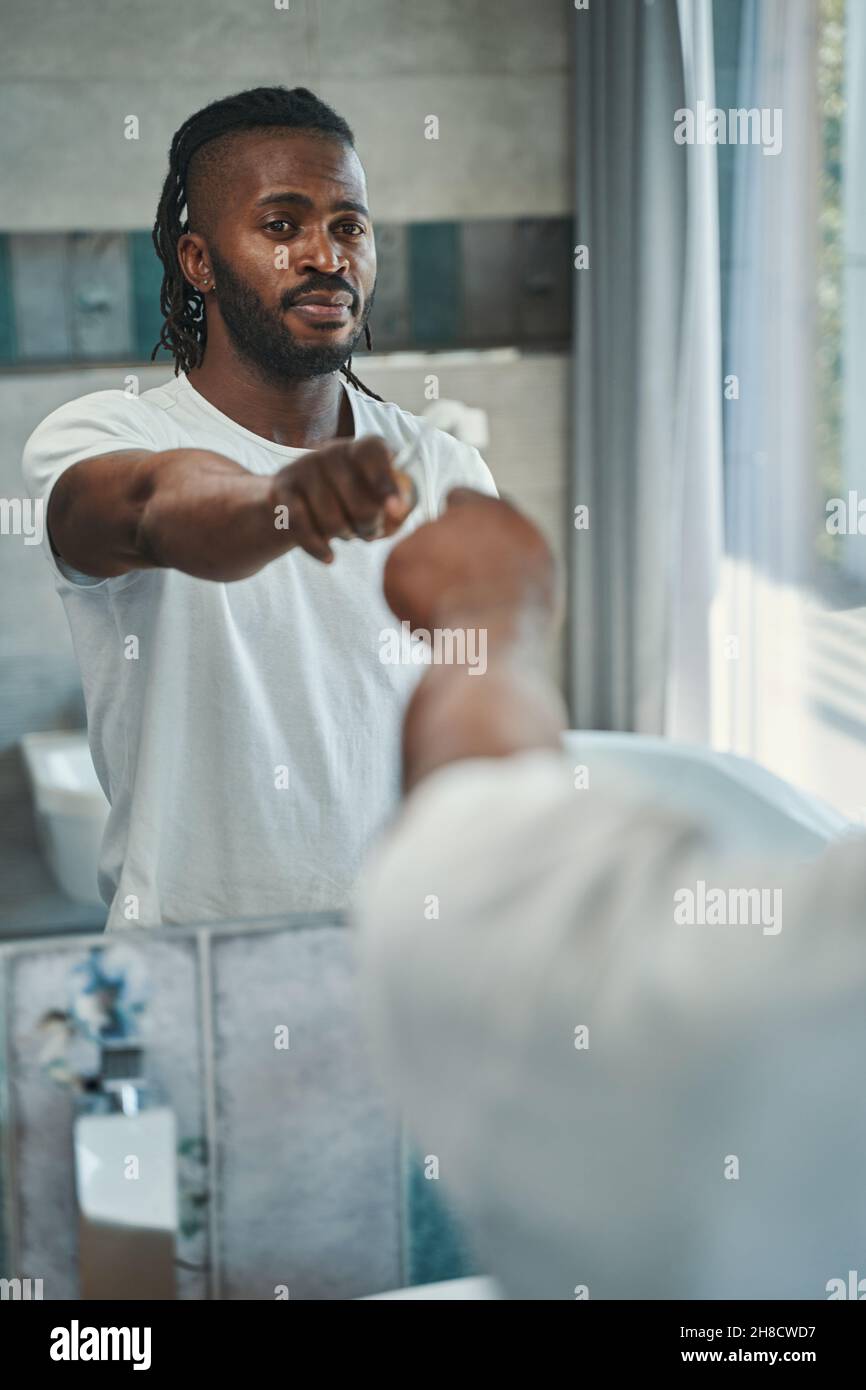 Man alone standing bathroom hi-res stock photography and images - Alamy