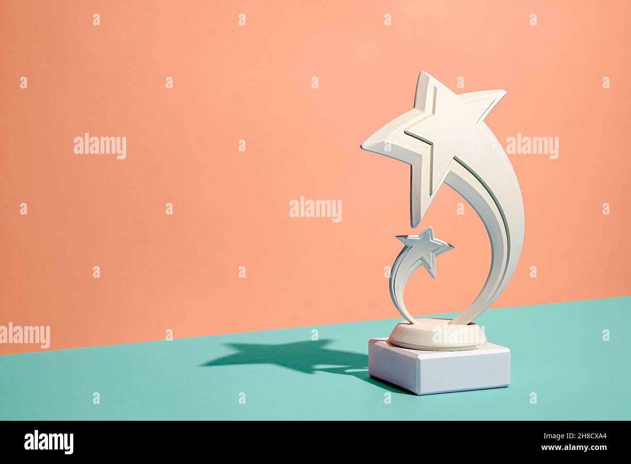 Dual shooting star trophy or ornament over a diagonal bicolor ...