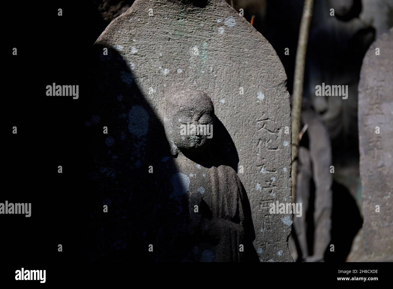 Statue in Japanese cemetery; Japan Stock Photo - Alamy