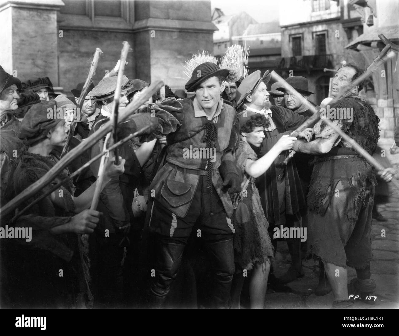ERROL FLYNN as Miles Hendon and BOBBY MAUCH as Prince Edward in THE ...