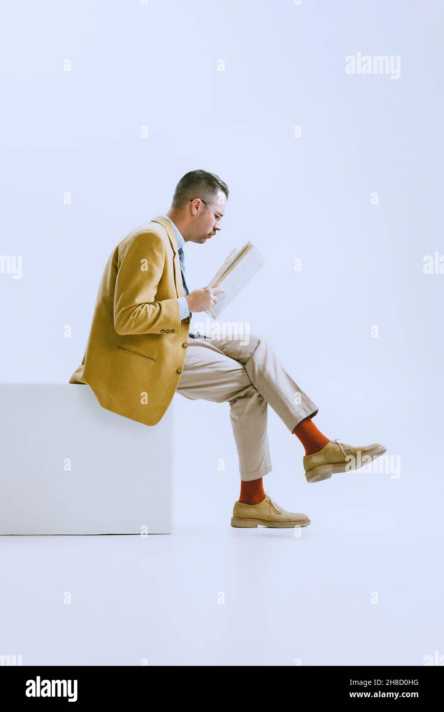 Portrait of young man, hipster or dandy, dude dressed in 50s, 60s style ...