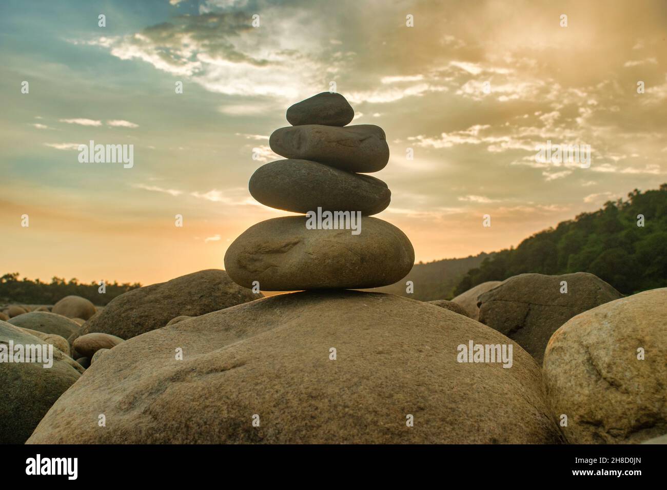 Balanced stones on a pebble beach during sunset in Bangladesh Stock ...