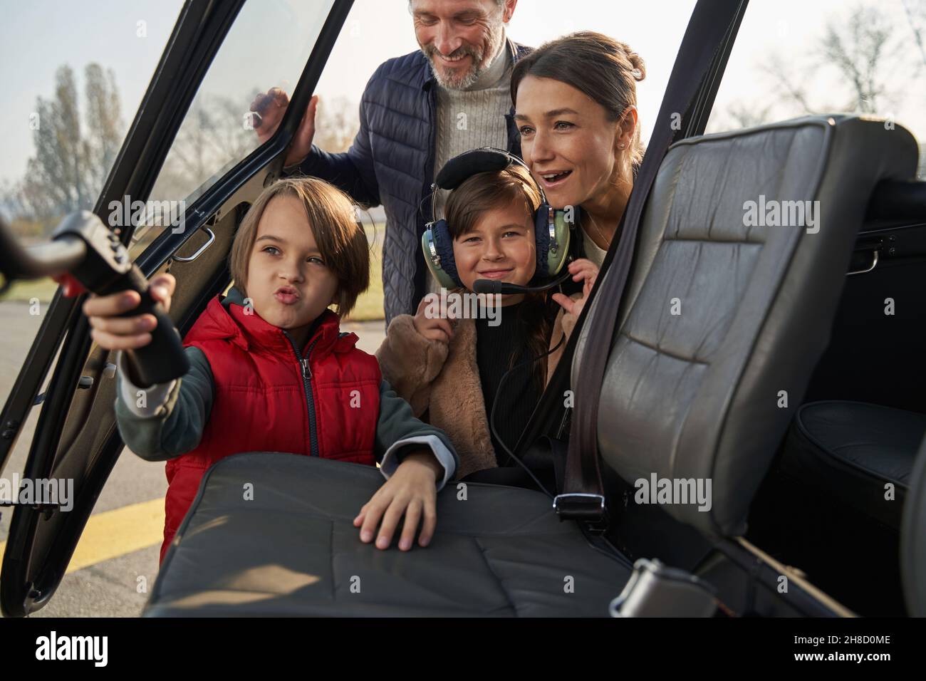 Lovely family spending time together on an aerial adventure Stock Photo ...