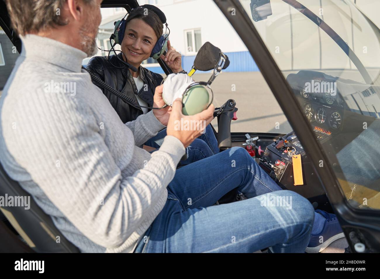 Adventurous couple getting ready for a helicopter flight Stock Photo ...