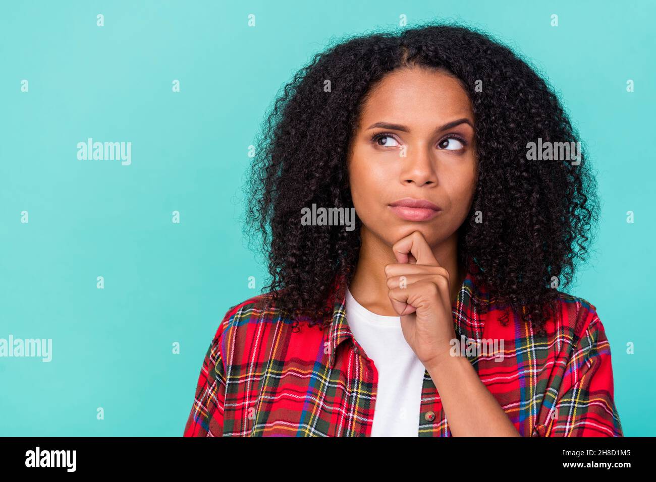 Photo of young attractive african woman hand touch chin guess look ...