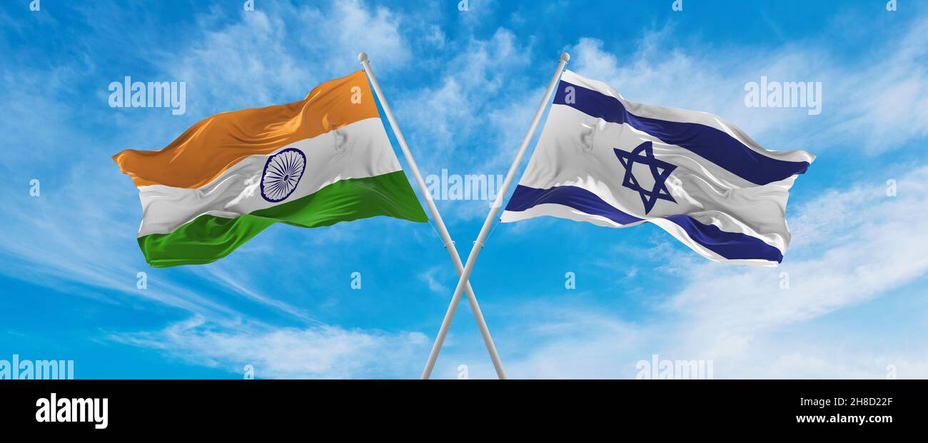 crossed national flags of India and Israel flag waving in the wind at ...