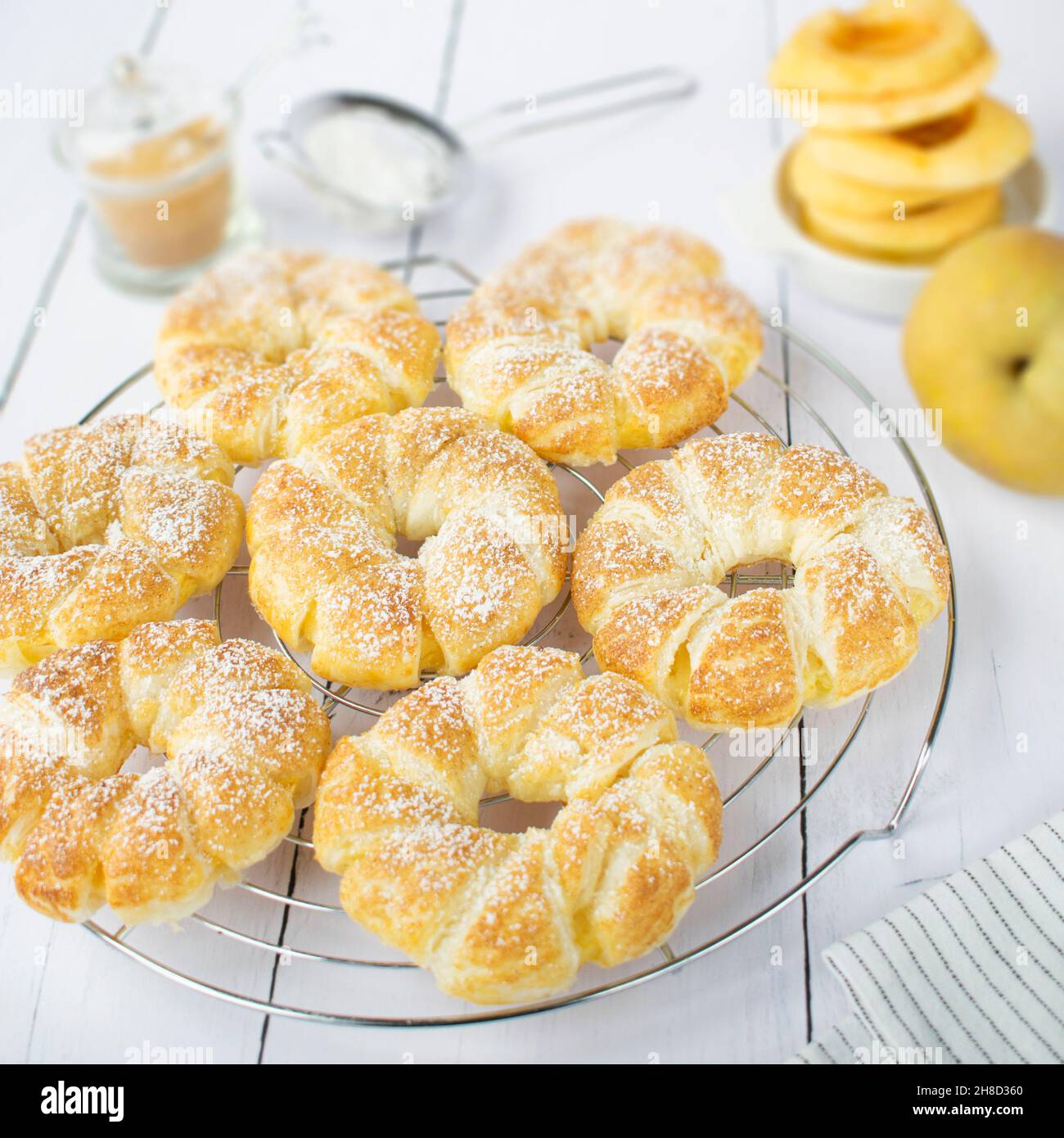 Apple rings in puff pastry, with cinnamon and powdered sugar Stock ...