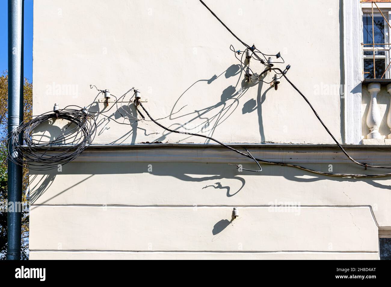 Electrical equipment and high voltage wiring lines on the wall of old ...