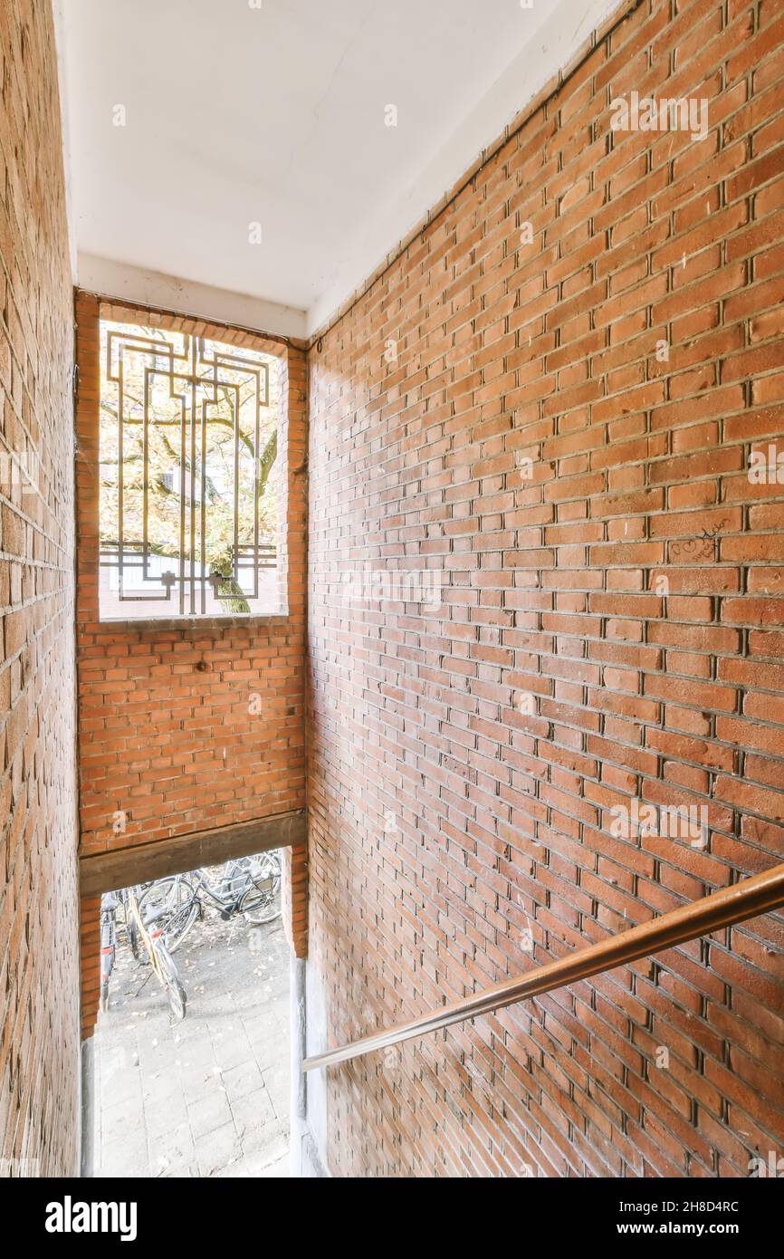 Adorable top view of the staircase of a building with a window with a ...