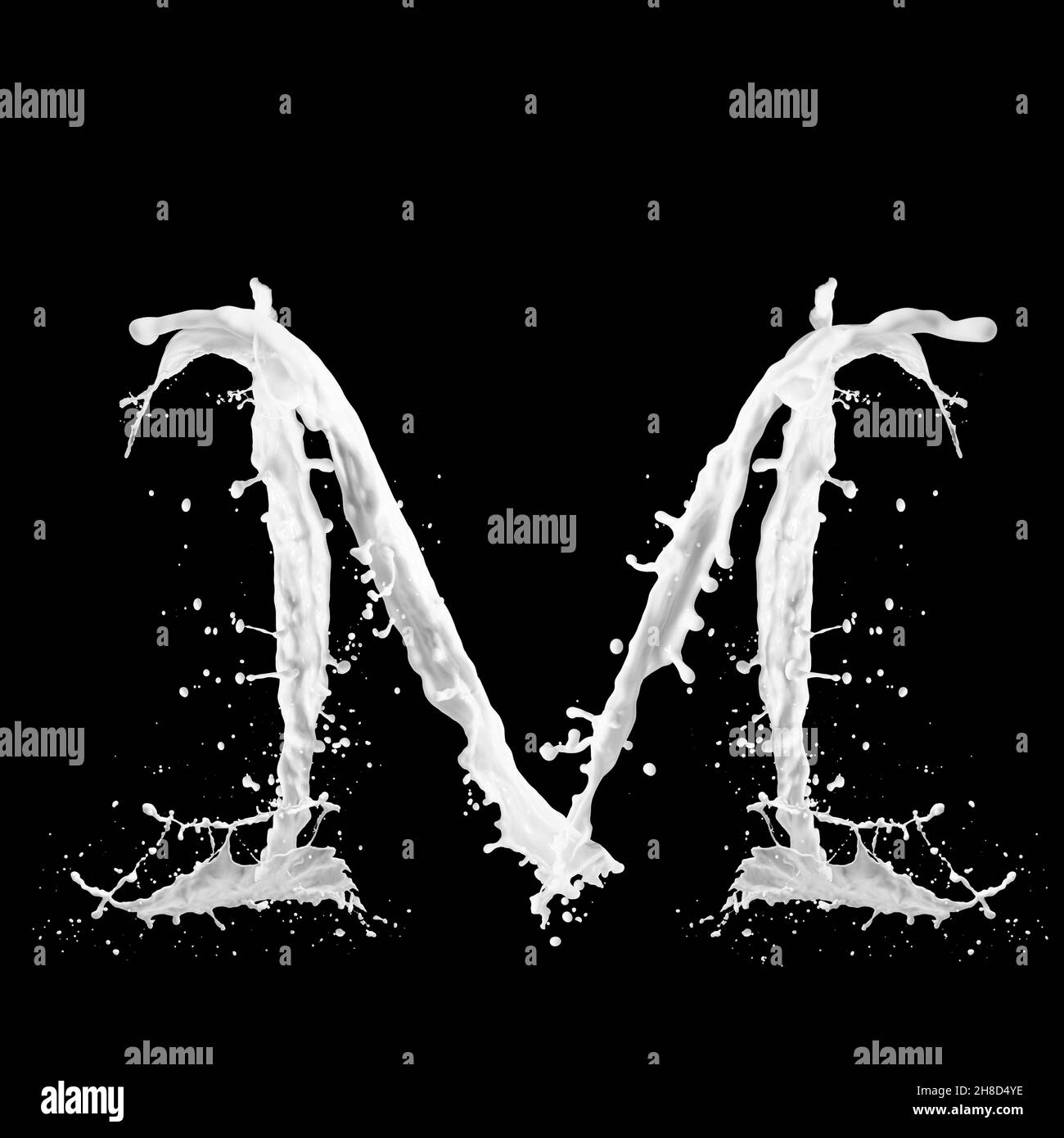 Letter M made of milk splash, isolated on black background Stock Photo ...