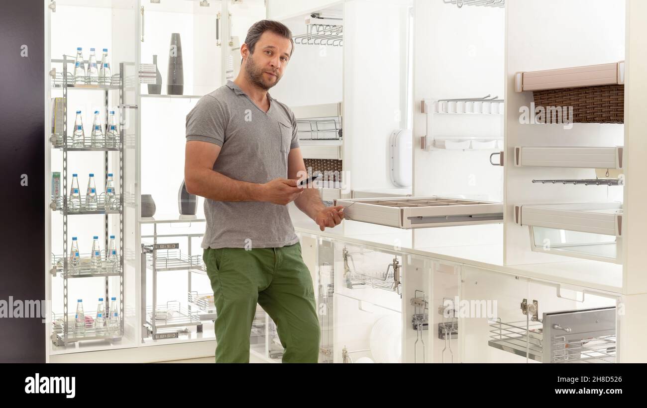 Kitchen cabinet organization ideas. The male buyer scans the QR code ...