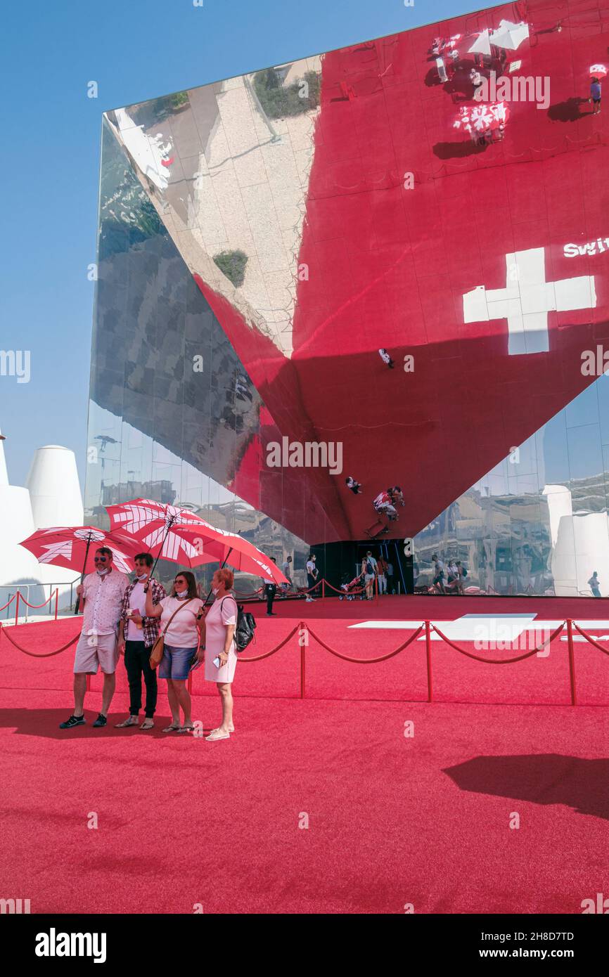 Visitors were given red umbrellas to pose with outside the Swiss ...