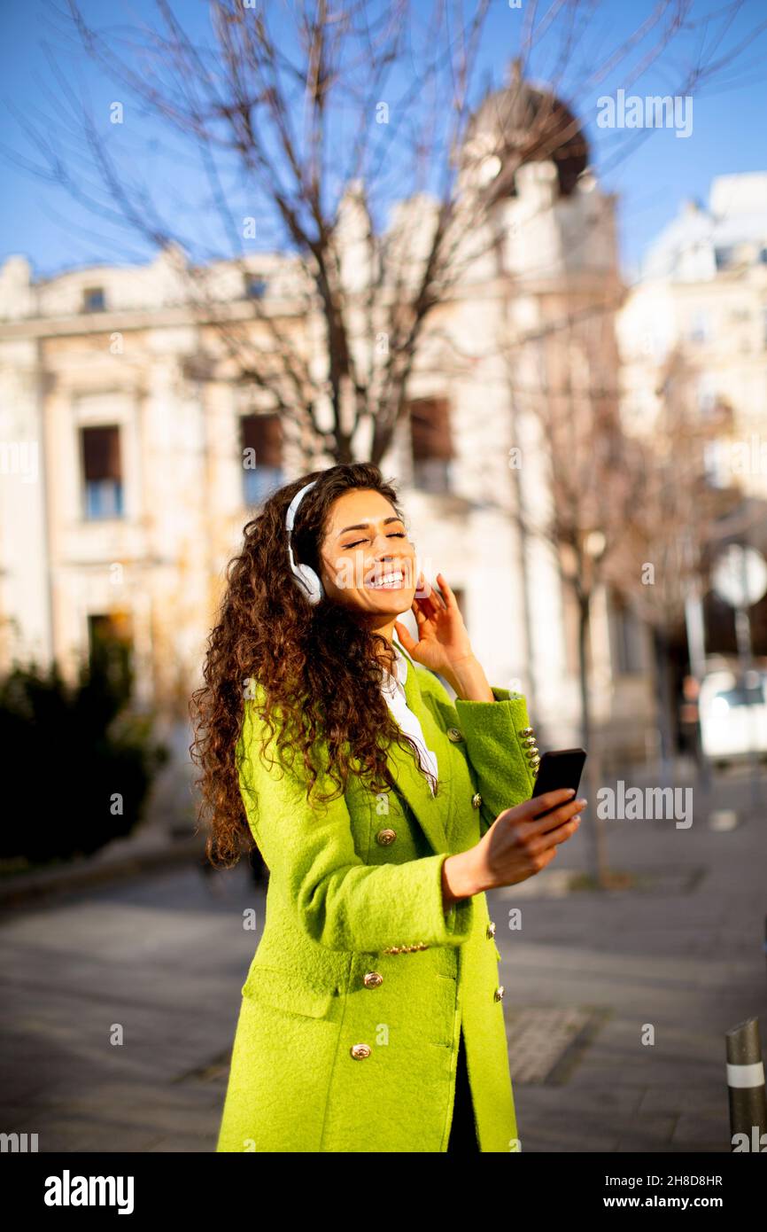 Pretty beautiful woman listening music hi-res stock photography and ...