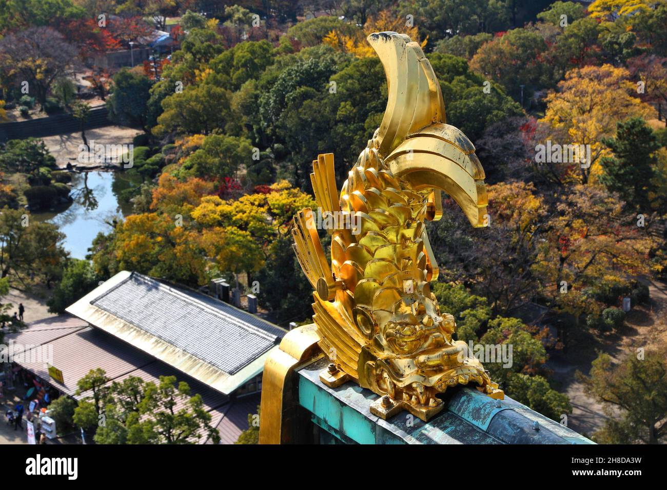Osaka Castle, Japan. Osaka landmark - gold fish sculpture Stock Photo ...