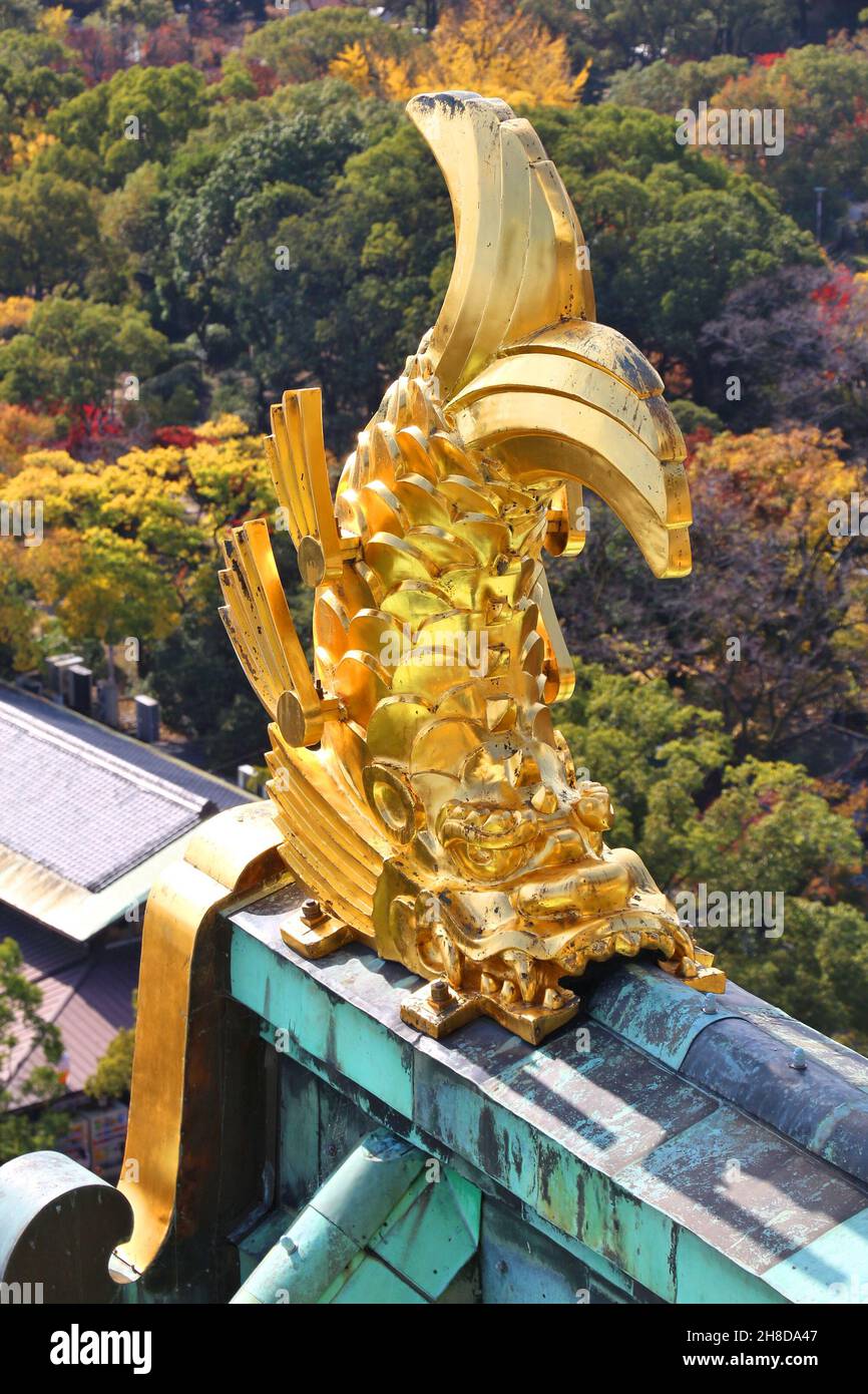 Osaka Castle, Japan. Osaka landmark - gold fish sculpture Stock Photo ...