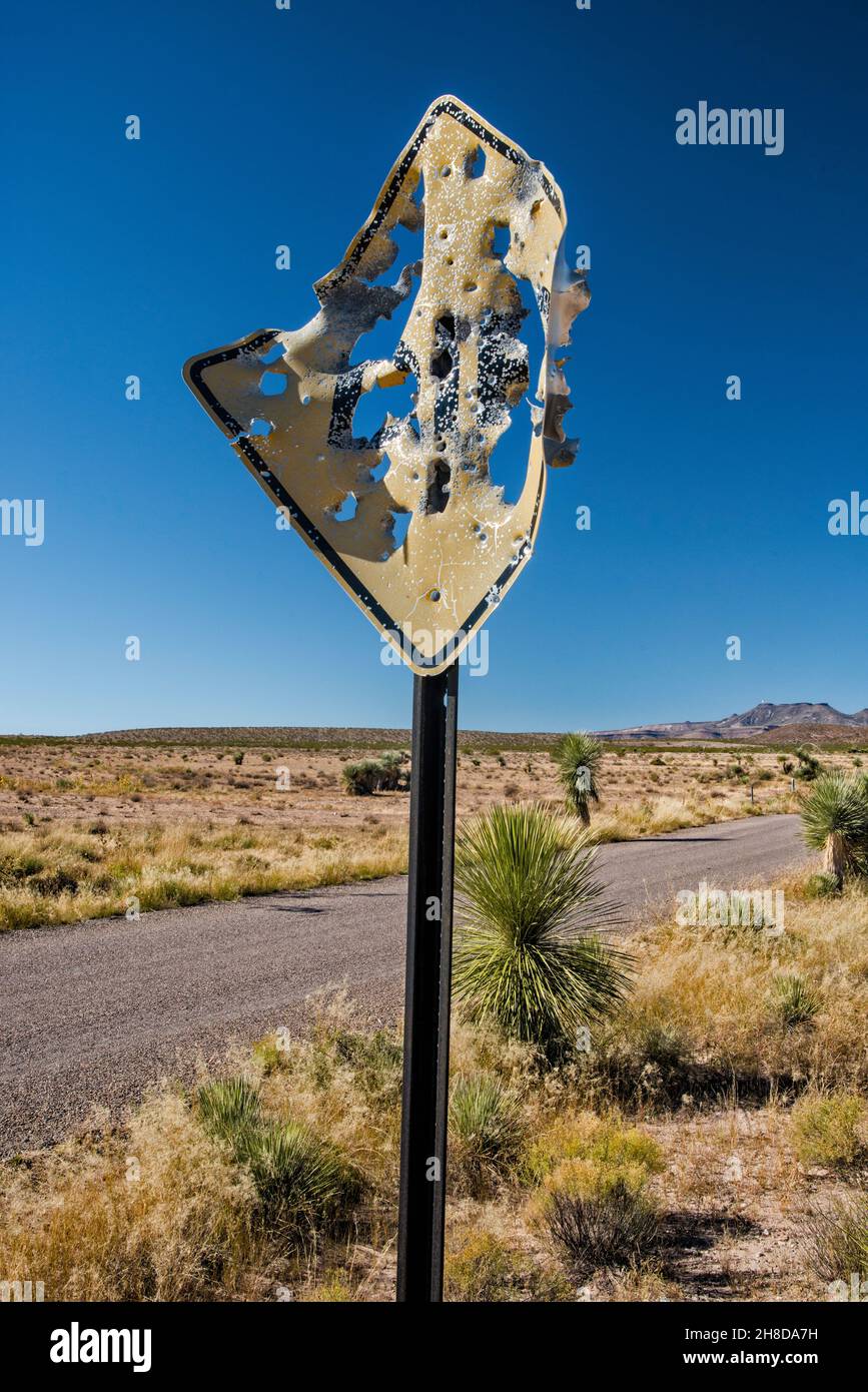 Road sign riddled with bullet holes, County Road D012, Organ Mountains ...