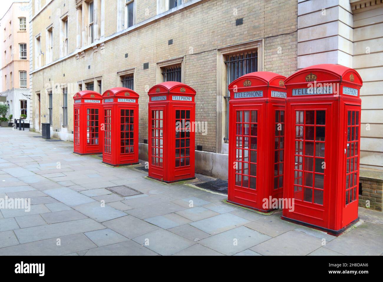 London telephone box row. London landmarks - red phone booth Stock ...