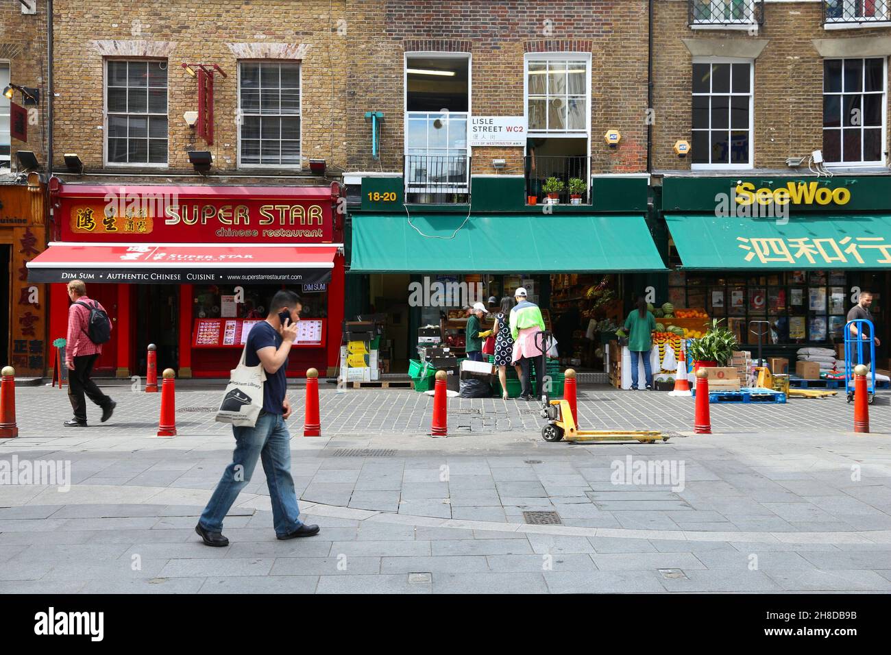 LONDON, UK - JULY 6, 2016: People visit Chinatown district of London ...