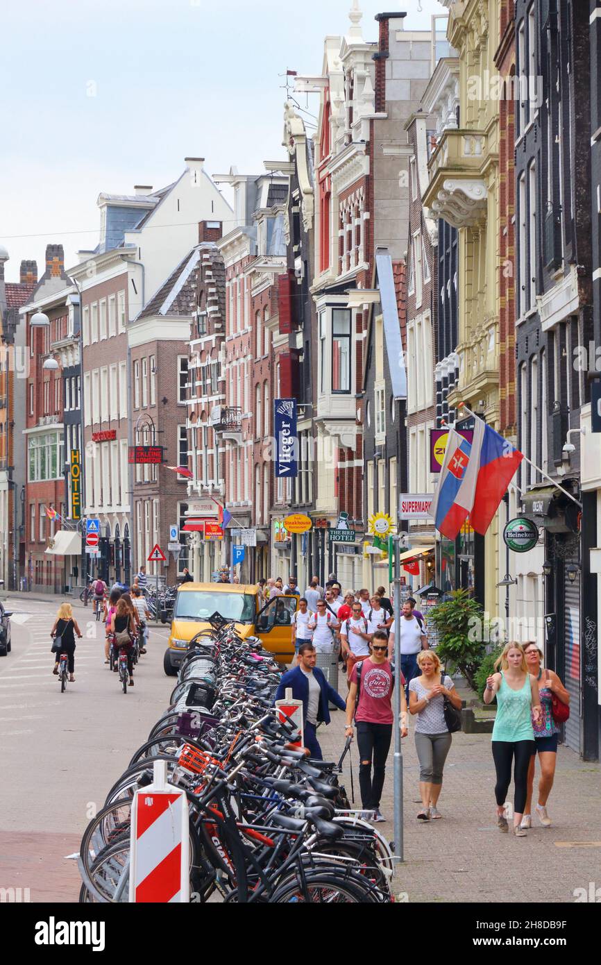 AMSTERDAM, NETHERLANDS - JULY , 2017: People shop at Amstel street in ...