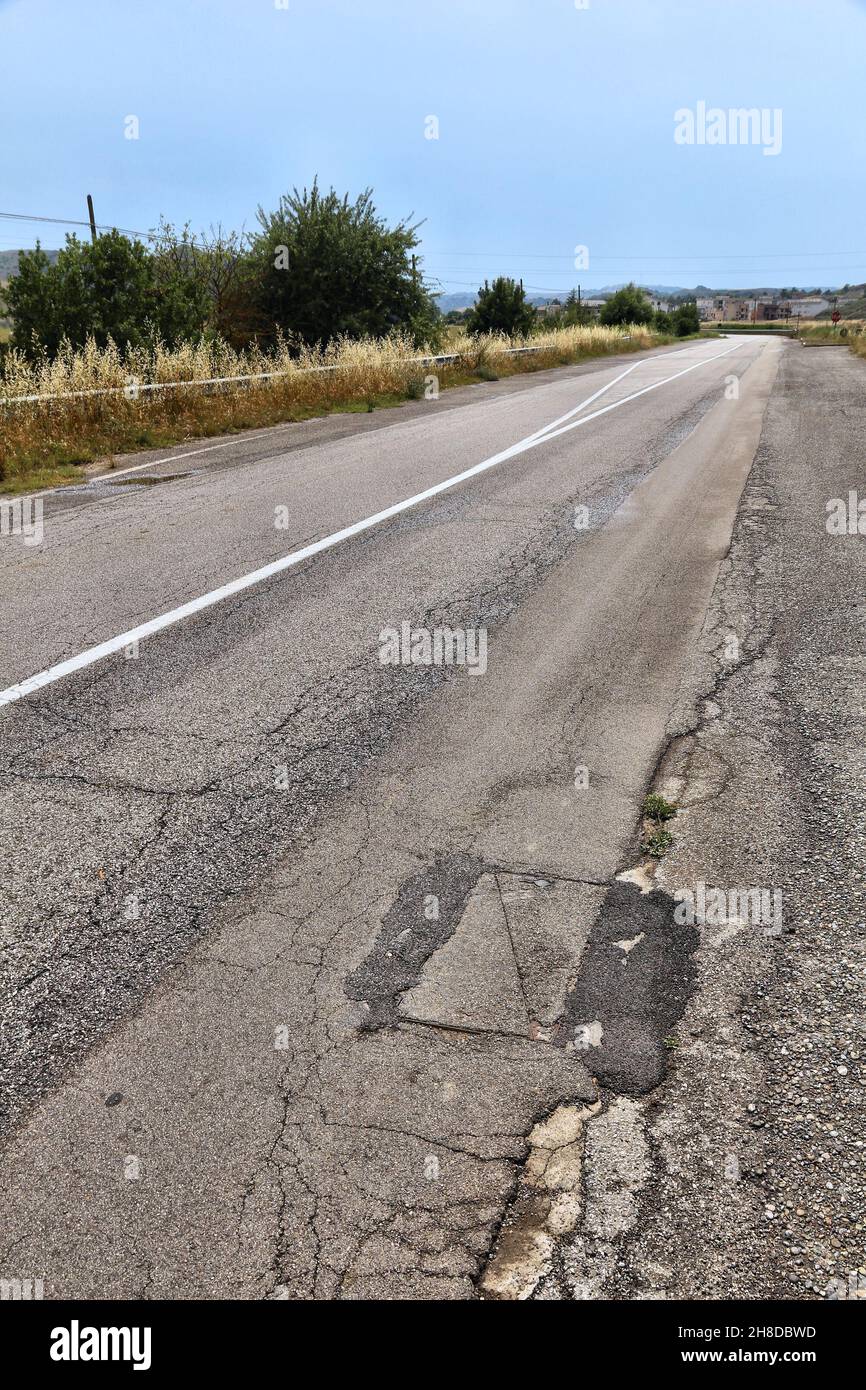 Road surface damage - bad maintenance quality. Asphalt cracks in Italy ...