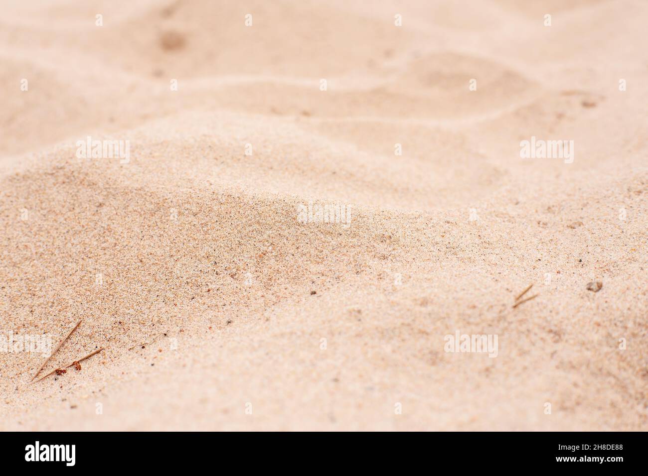 Yellow sand on a summer day, on the beach. Background Stock Photo - Alamy