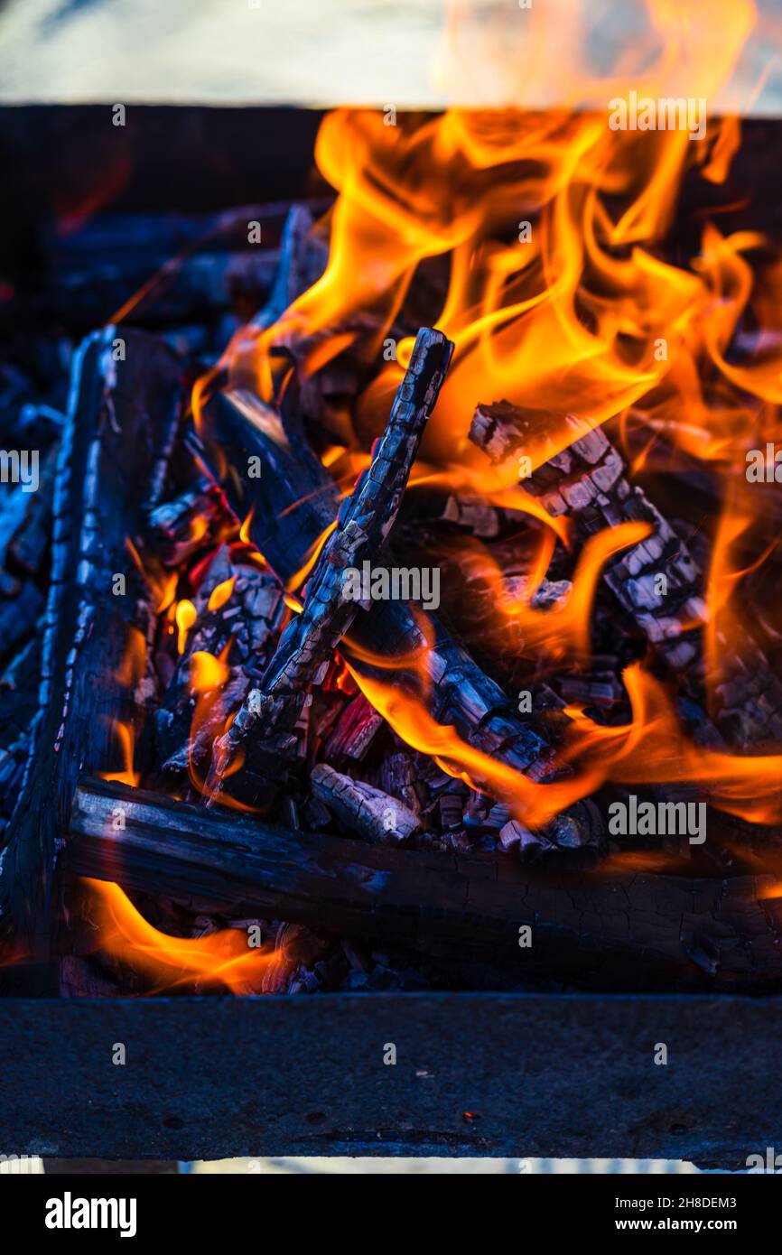 Burning wood chips to form coal. Barbecue preparation, fire before ...