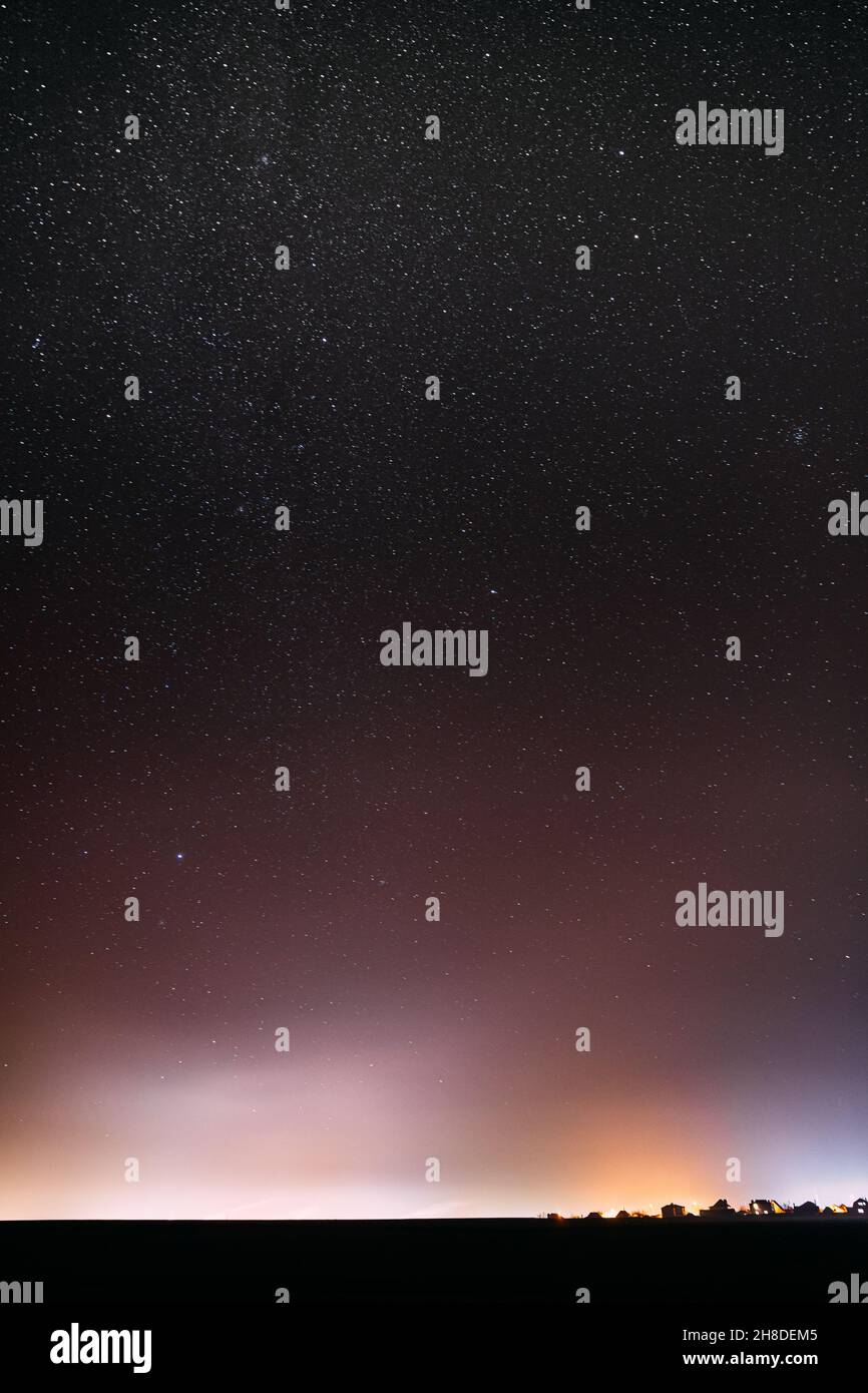 Night Starry Sky With Glowing Stars Above Countryside Town Landscape ...