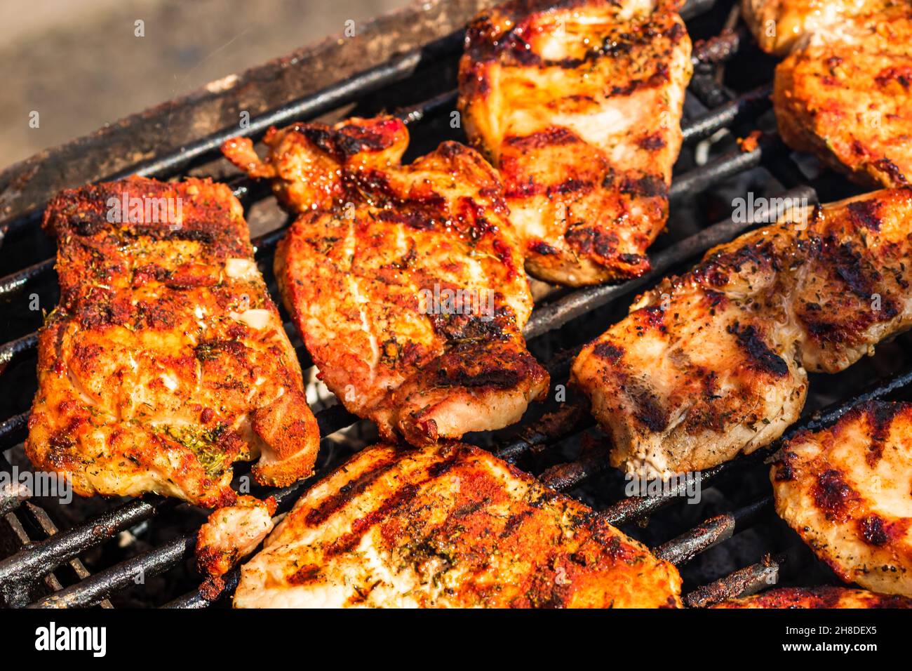 Detail of tasty pork steak on rustic background Stock Photo - Alamy
