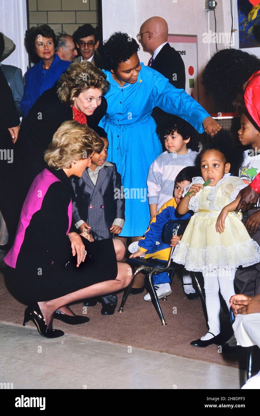 Diana, Princess of Wales kneeling to the level of children during a ...