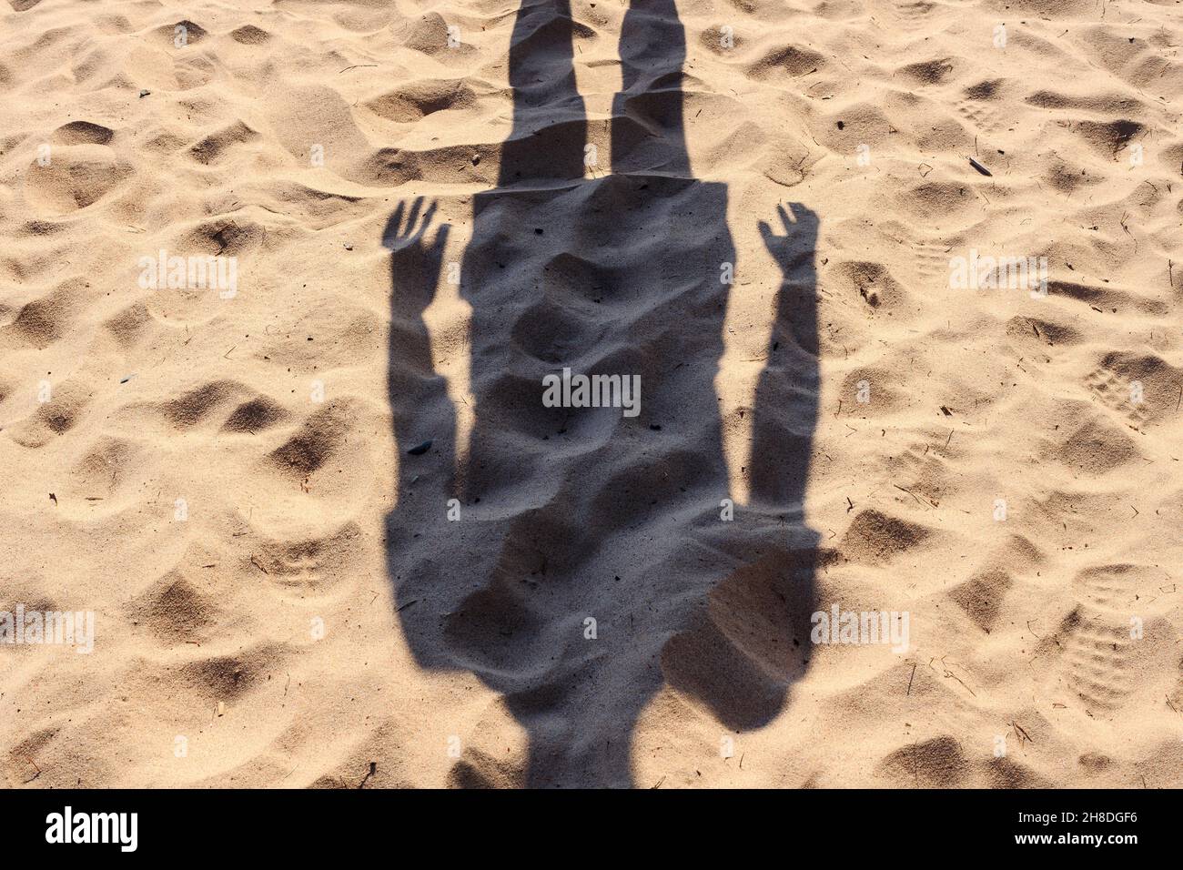 Human shadow on beach hi-res stock photography and images - Alamy