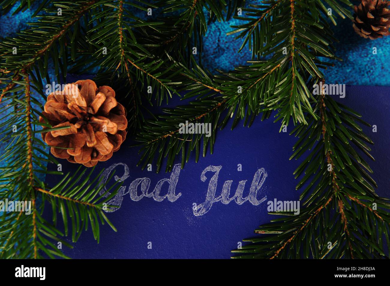 Closeup shot of a Norwegian Christmas greeting, written in chalk on a ...