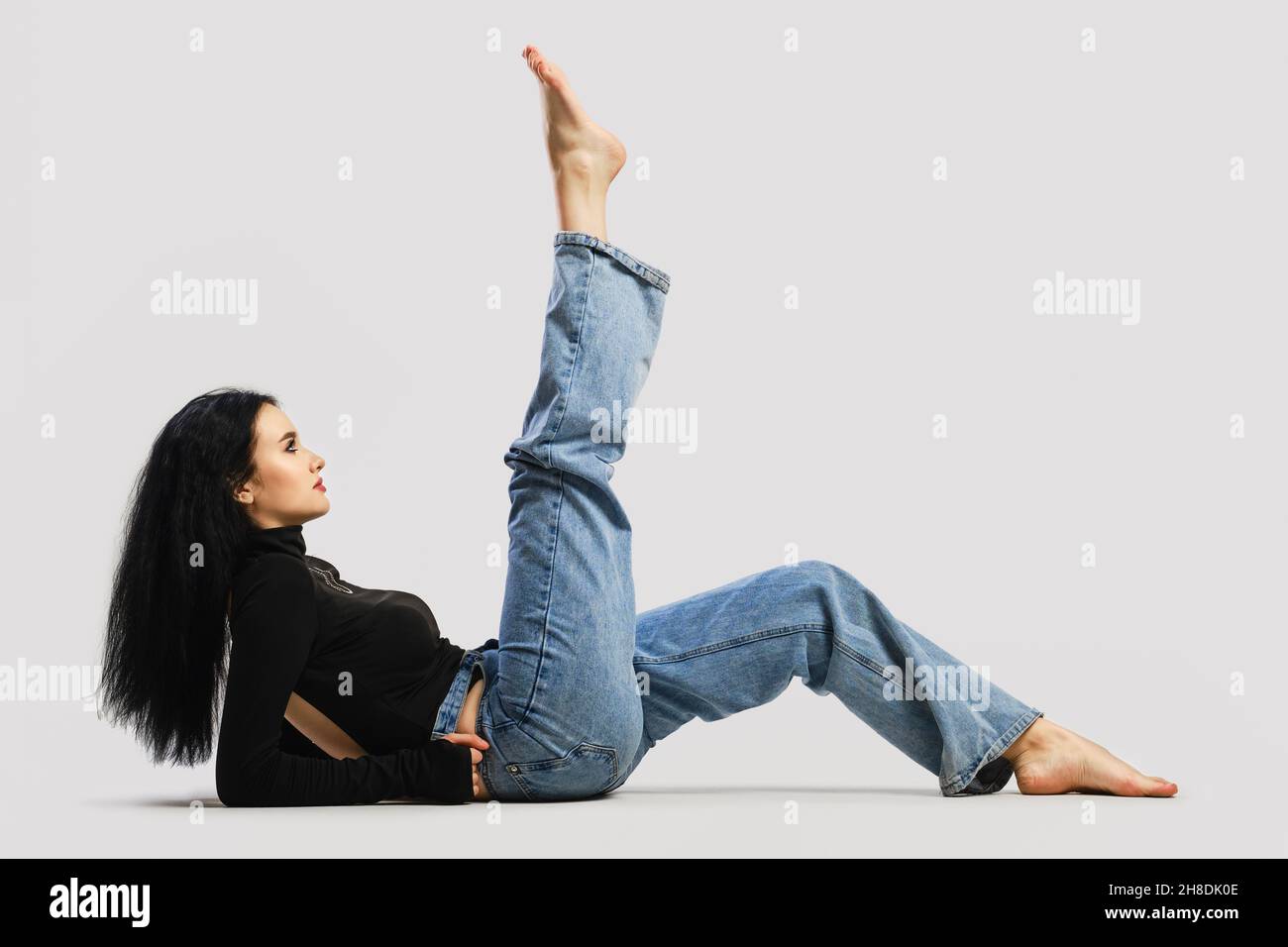 Beautiful woman on background raises hi-res stock photography and ...