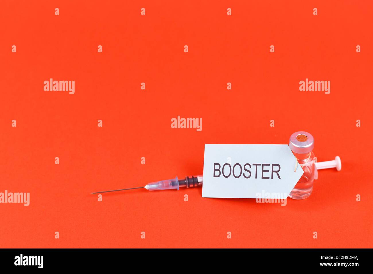 Corina virus booster vaccination concept with vial and syringe in ...