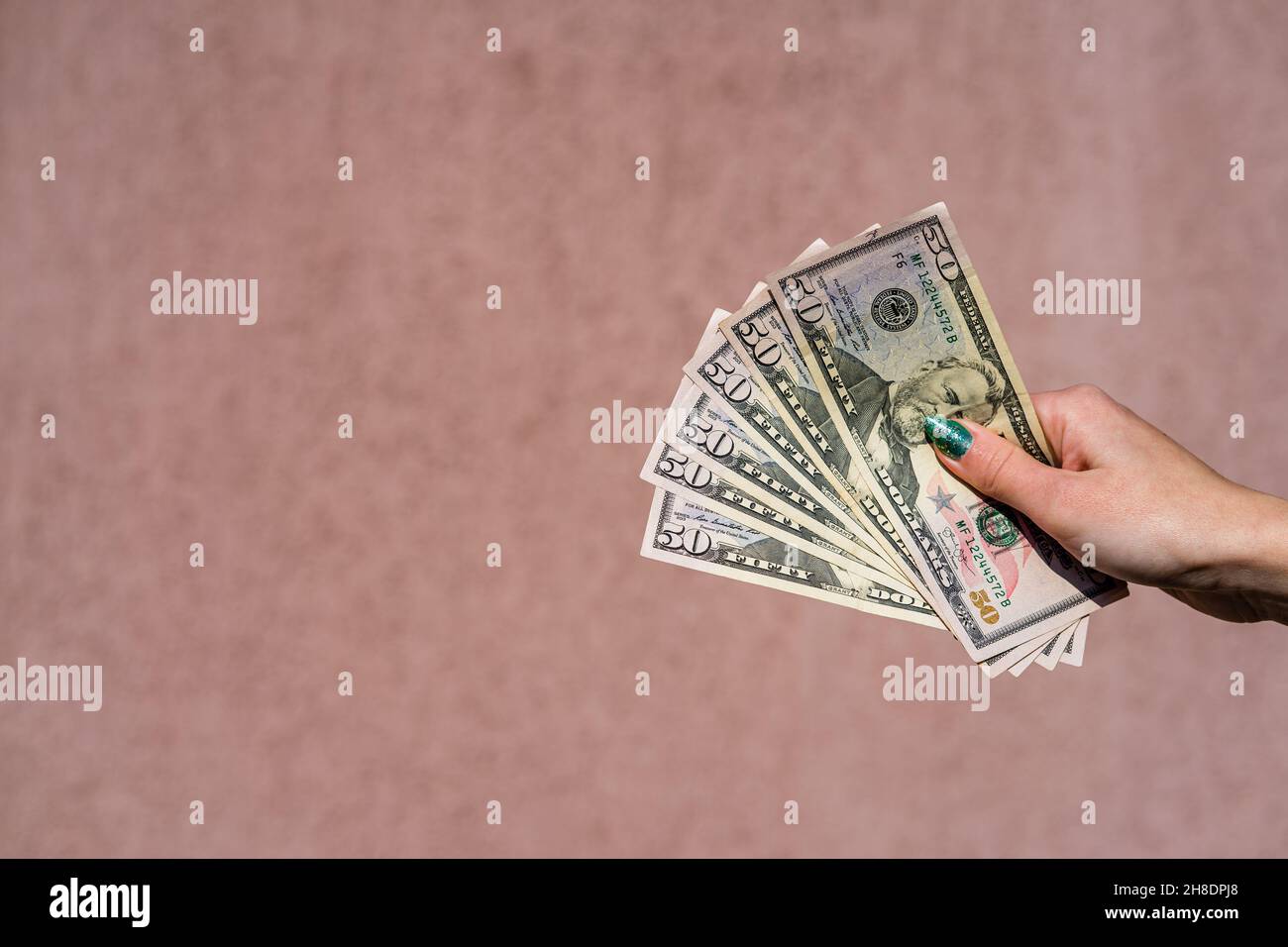 Hand holding showing dollars money and giving or receiving money like ...