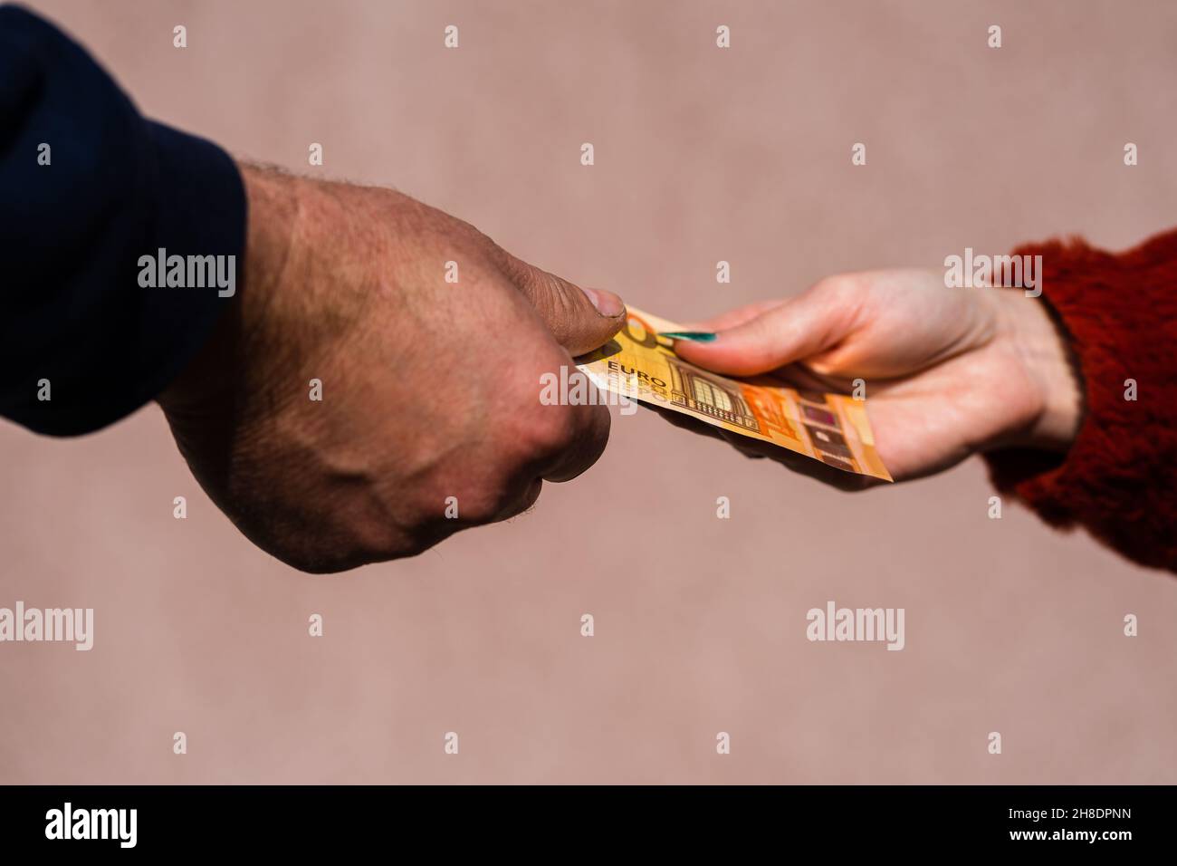 Hand giving money like bribe or tips or salary isolated, hard worked ...