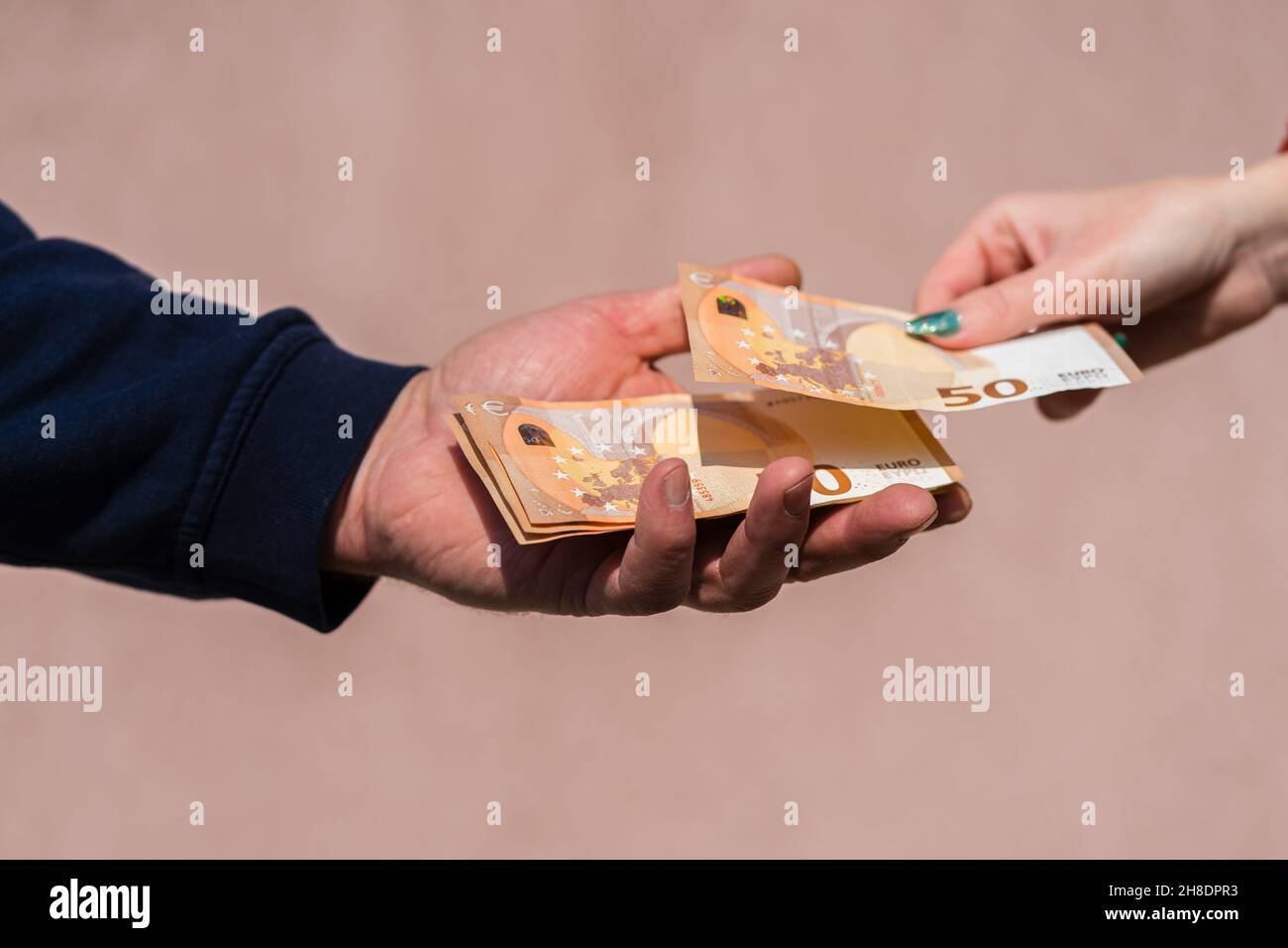 Hand giving money like bribe or tips or salary isolated, hard worked ...